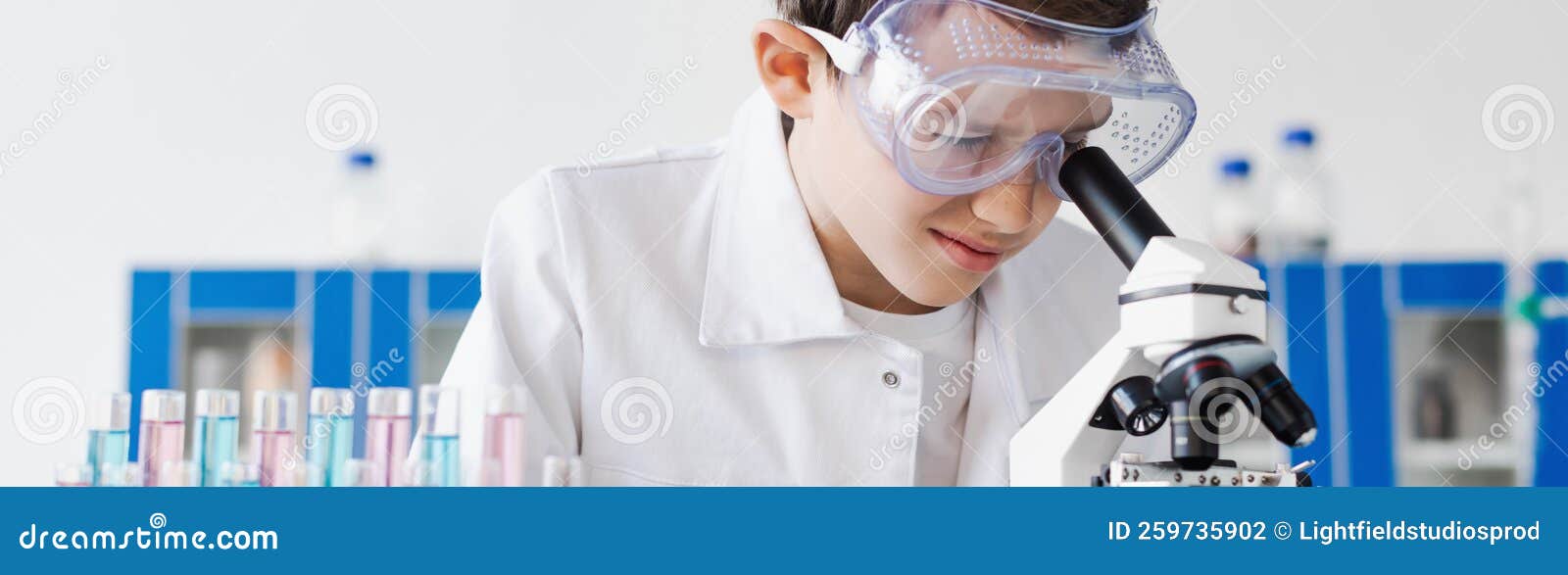 Kid in Goggles Looking into Microscope Stock Photo - Image of equipment ...