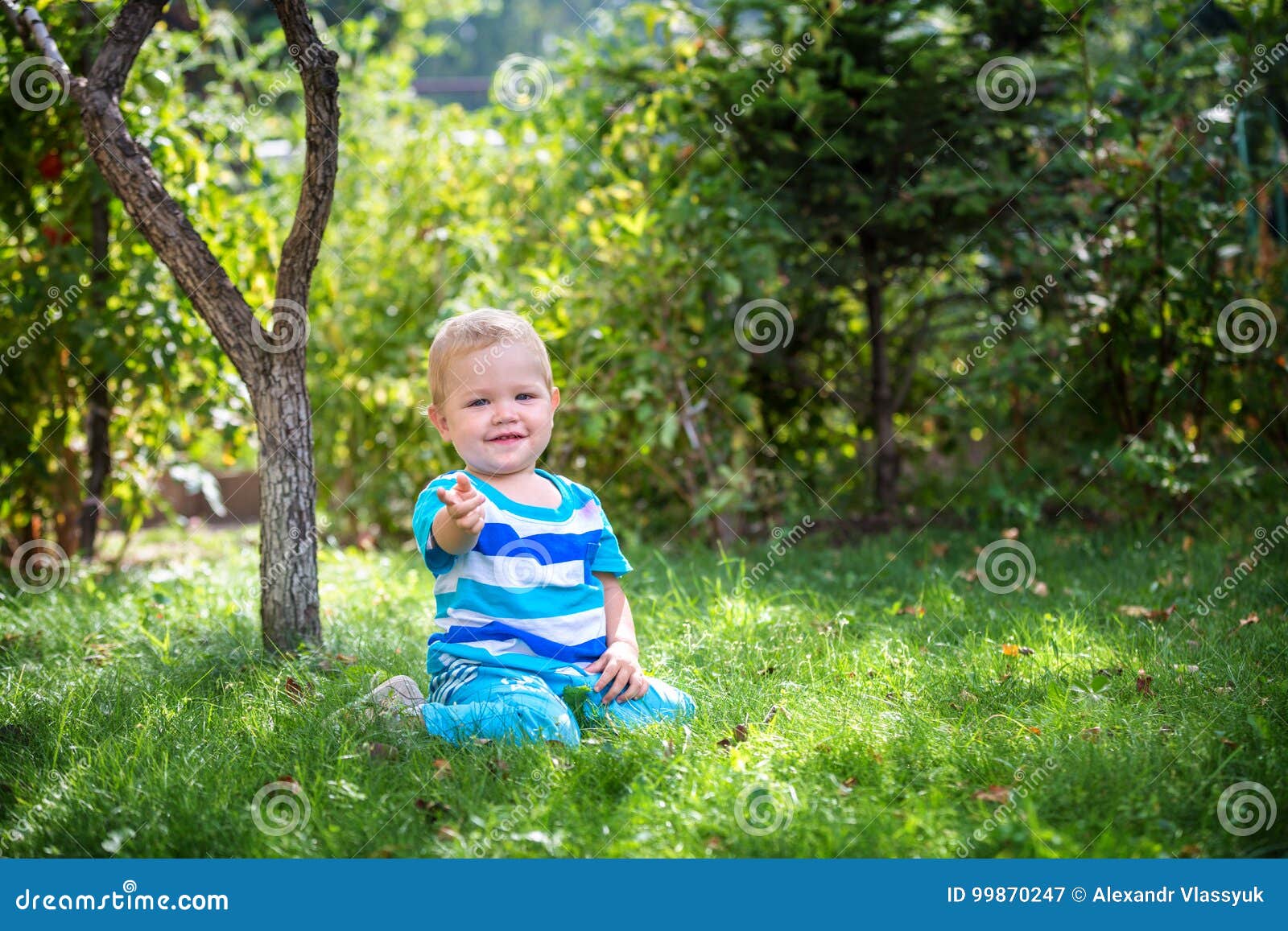 Kid stock image. Image of spring, grass, tree, nature - 99870247