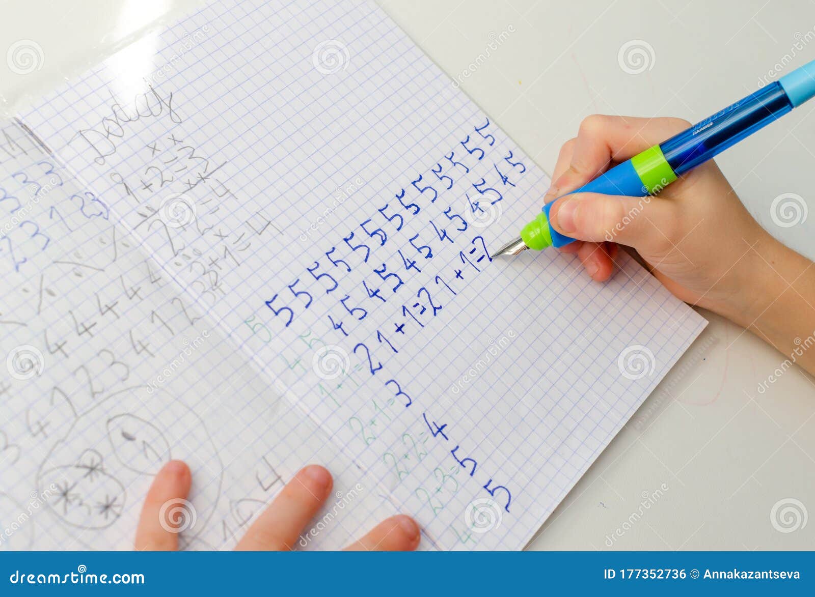 Kid Hands Doing Math Homework. Close Up of Young Boy Hand Holding Pen ...