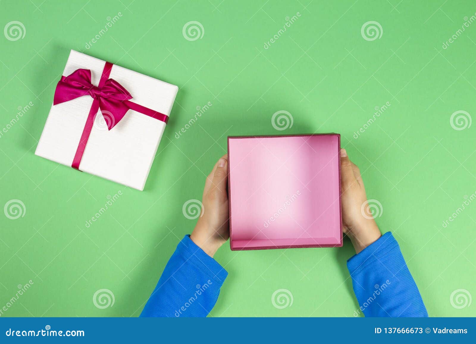 Kid Hands Hold the Blank Empty Present Gift Box on Pastel Green ...
