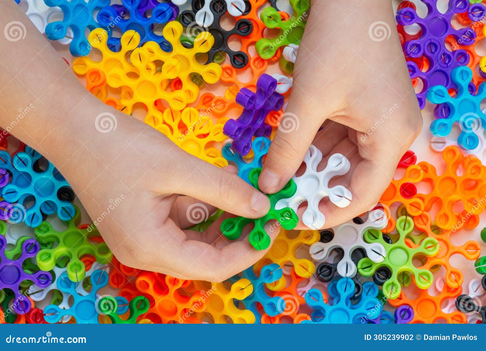 Kid Hands Playing with Colorful Connector Toy. Educational Activity ...