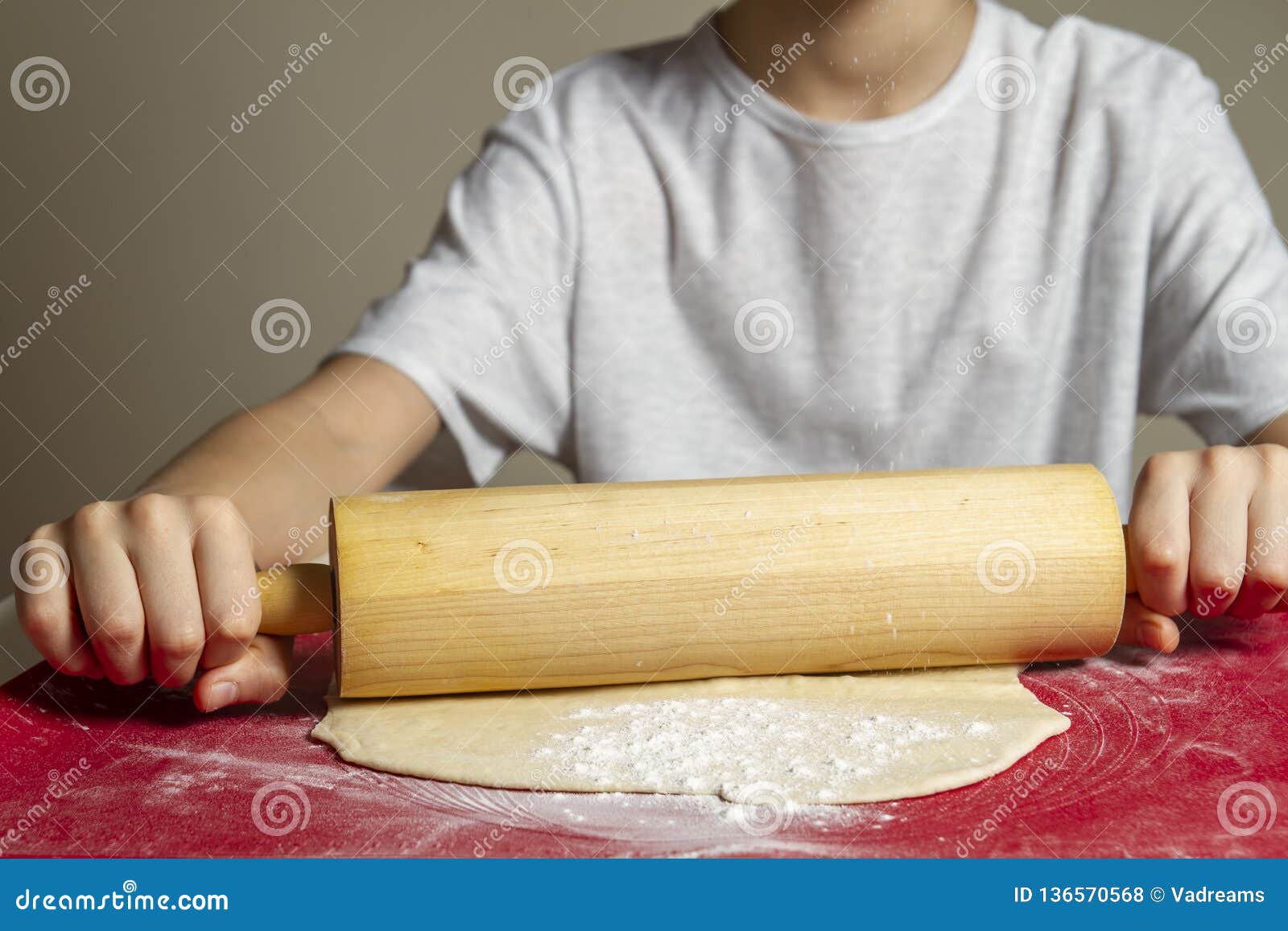 Kid Hands Rolls Out the Pizza Dough with the Rolling Pin on Silicone ... Kid Hands Rolls Out the Pizza Dough with the Rolling Pin on Silicone ...