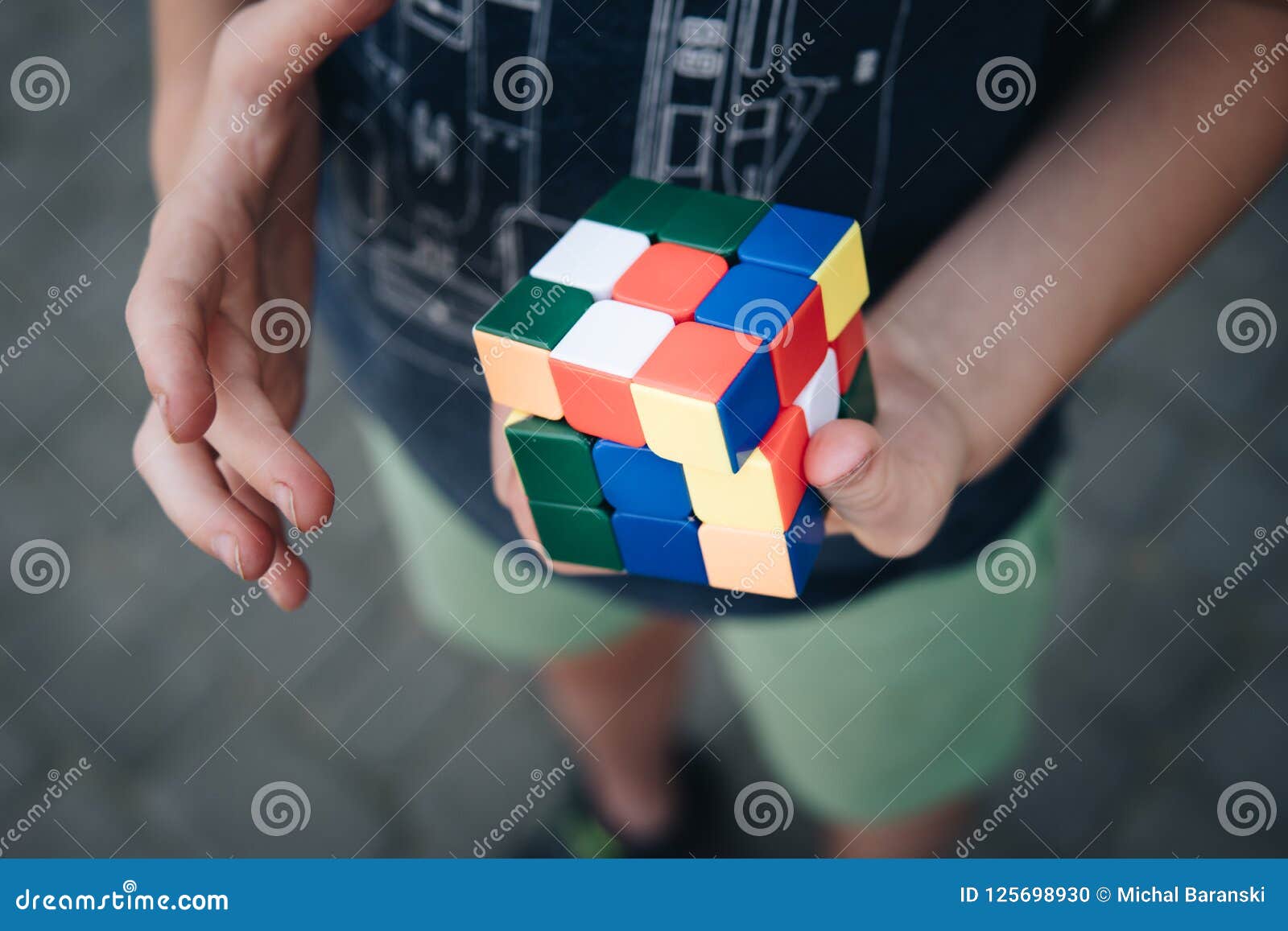 Kid holding rubik cube editorial image. Image of square - 125698930