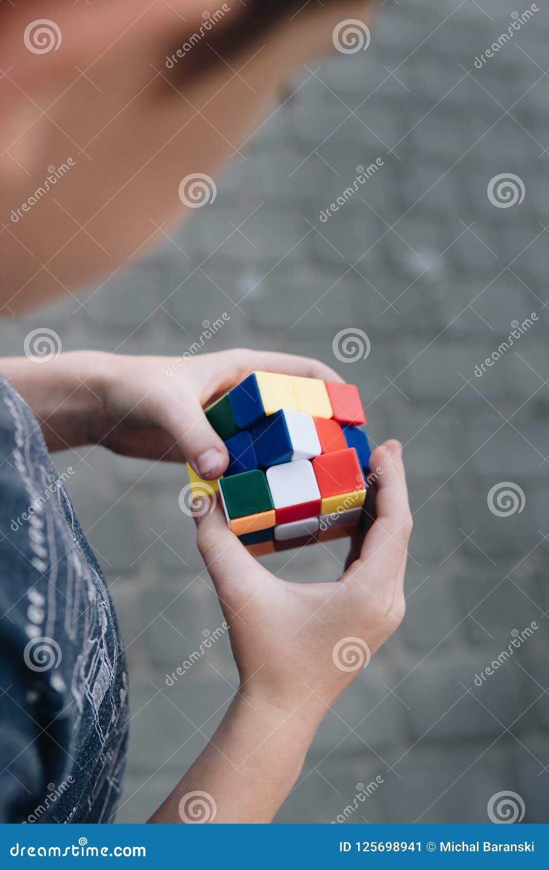 Kid holding rubik cube editorial photo. Image of holding - 125698941