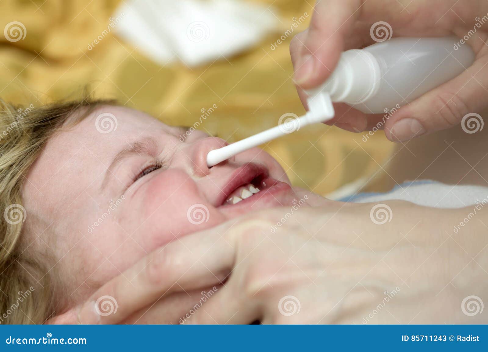 Kid Inhaling Nasal Spray stock image. Image of child - 85711243