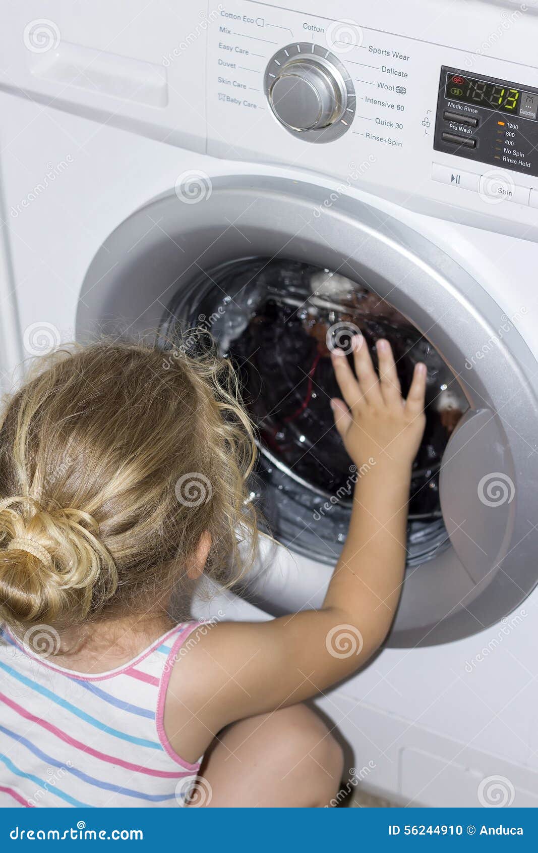 Kid Interested in Washing Machine Stock Photo - Image of prying, period ...