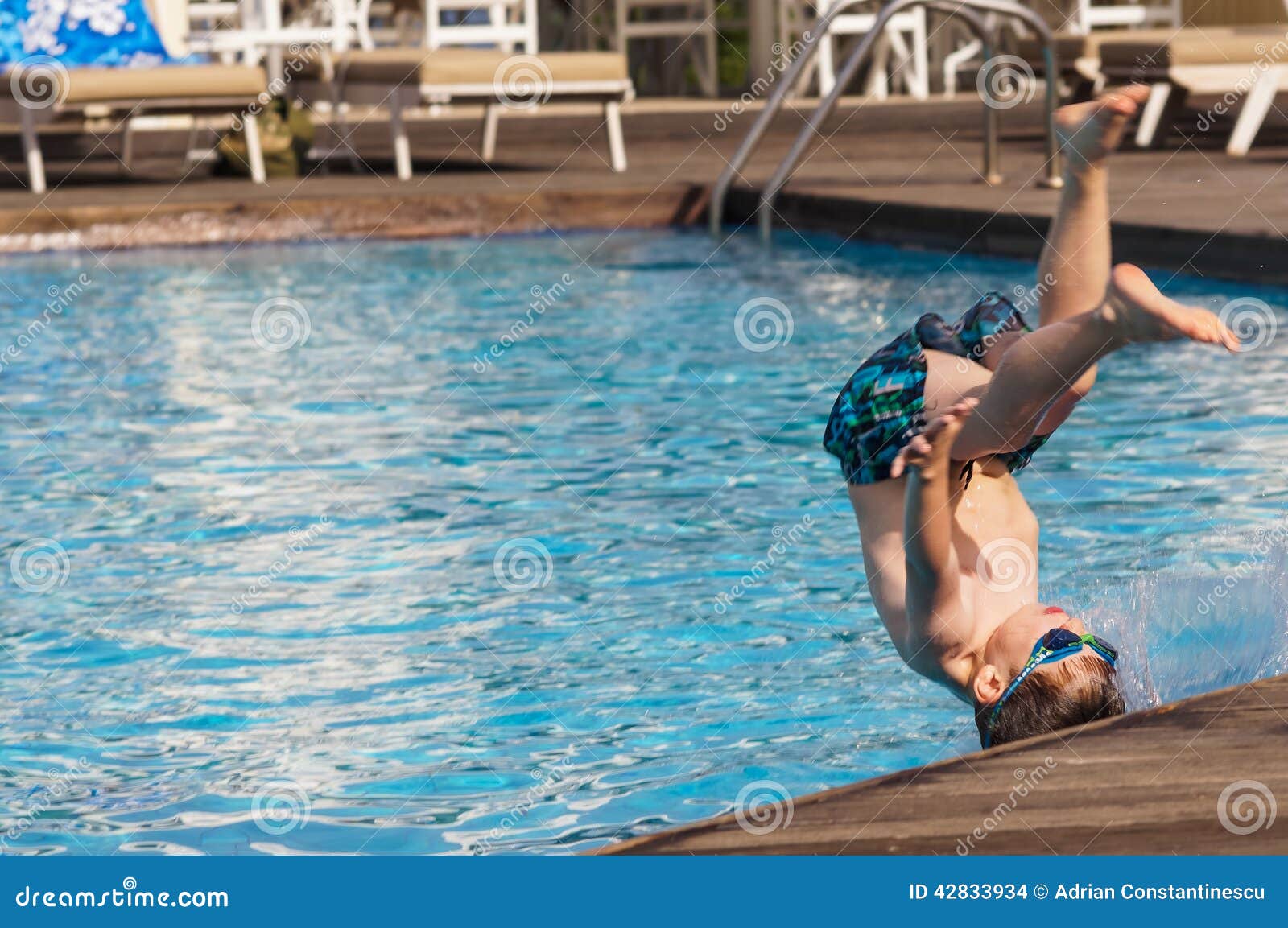 Kid jumping in the pool stock photo. Image of children - 42833934
