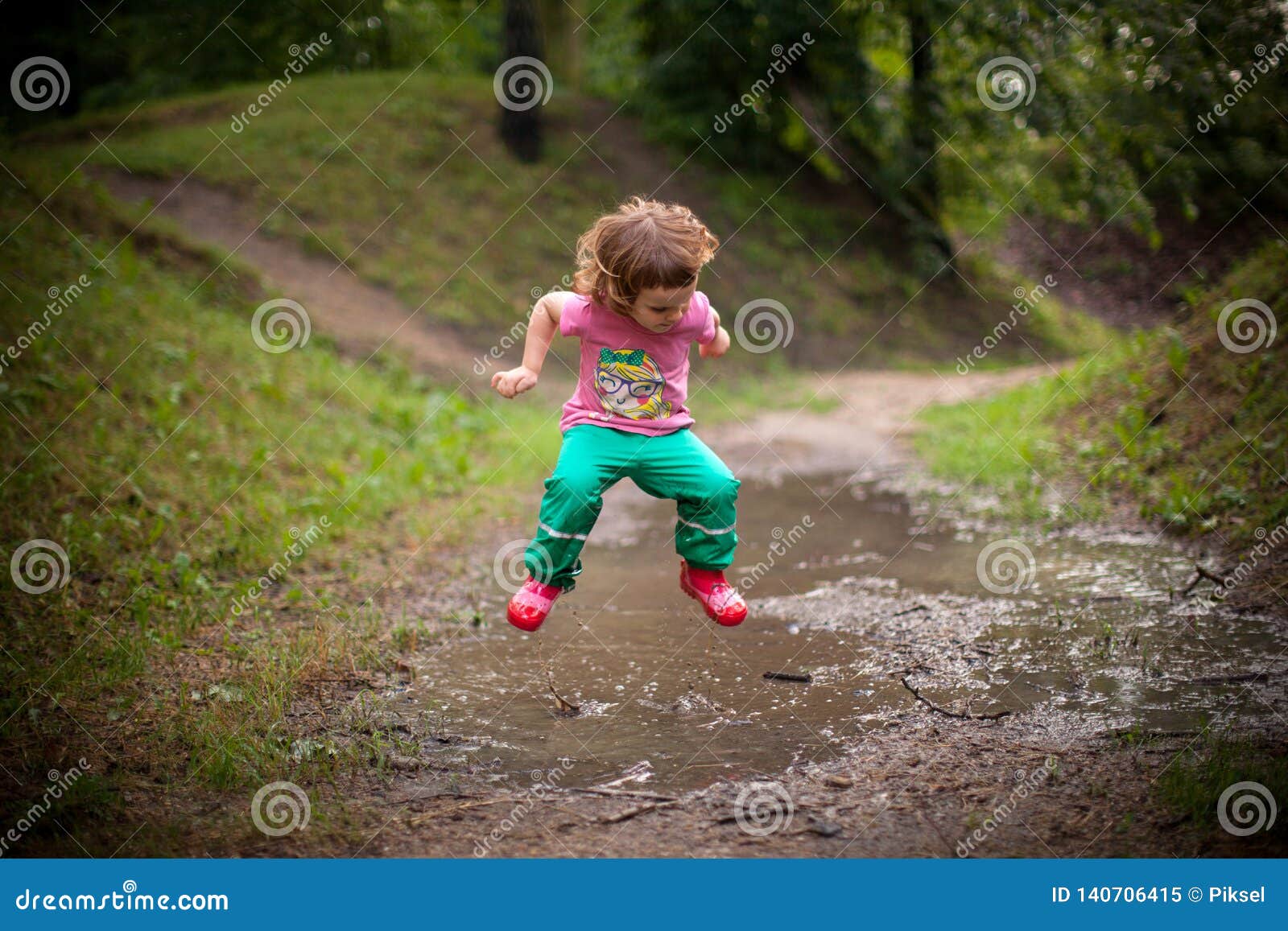 Kid Jumping Into Water Puddle Stock Image | CartoonDealer.com #140706415