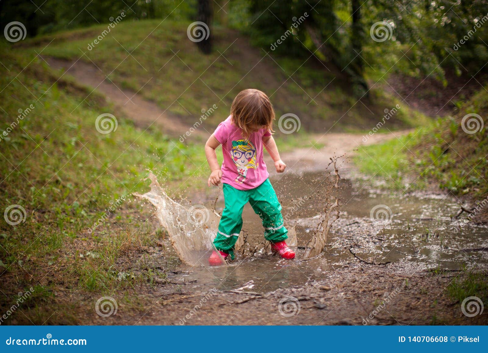 Kid Jumping into Water Puddle Stock Photo - Image of emotions, autumn ...