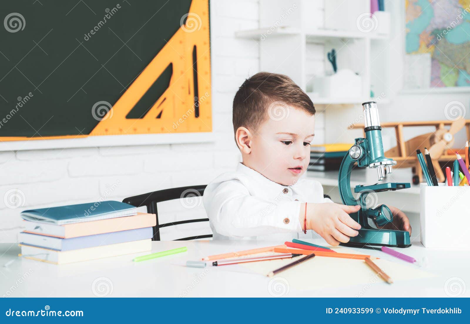 Kid is Learning in Class on Background of Blackboard. School Kids. Home ...