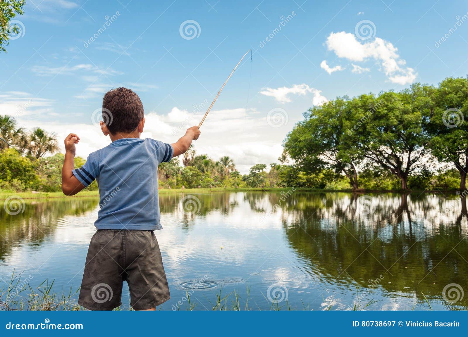 Kid Learning How To Fish, Holding a Rod on a Lake Editorial Photography ...