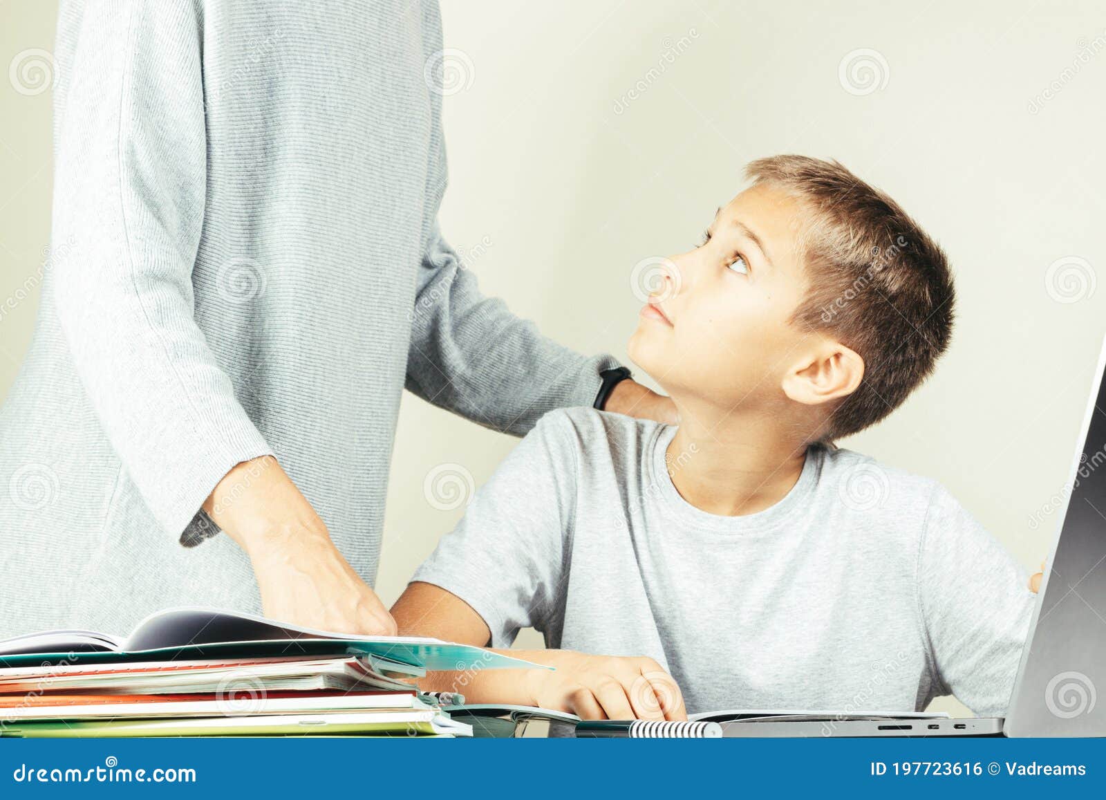 Kid Learning Online with Laptop Computer at Home. Mother Help Him ...