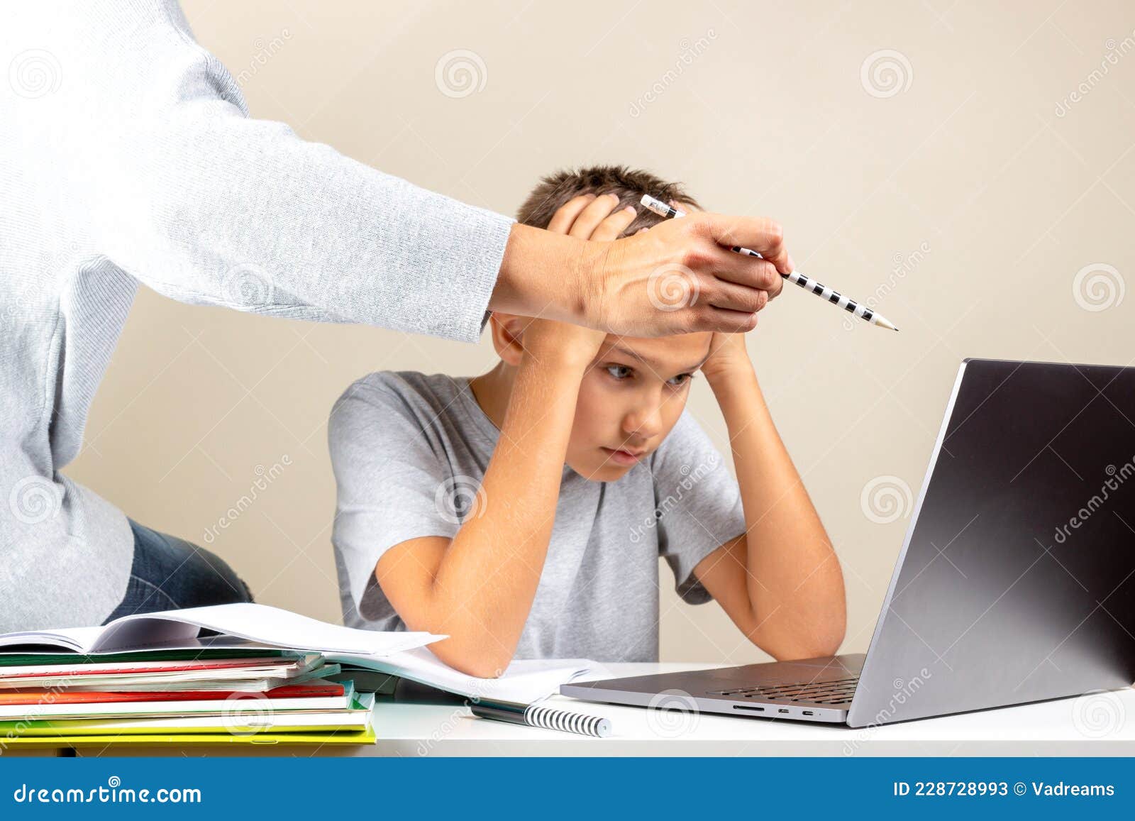 Kid Learning Online with Laptop Computer at Home. Mother Help Him ...