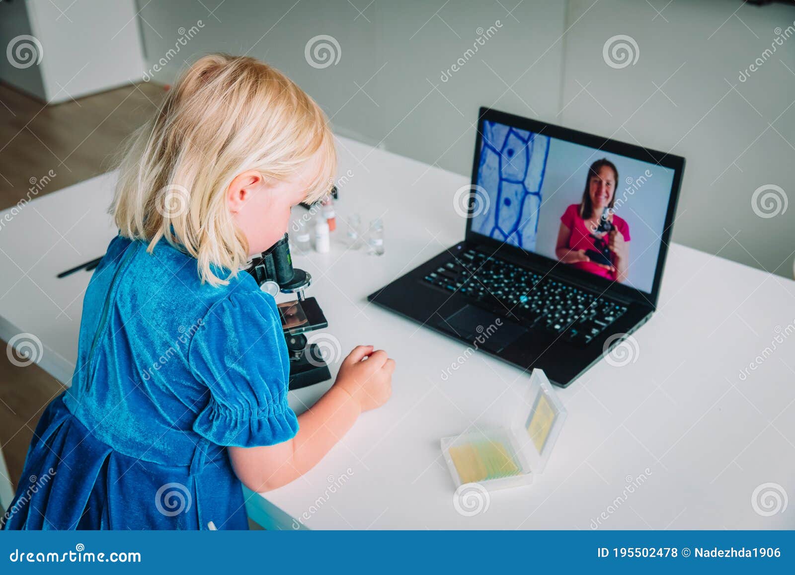 Kid Learning Remotely. Girl Making Experiments, Looking through ...