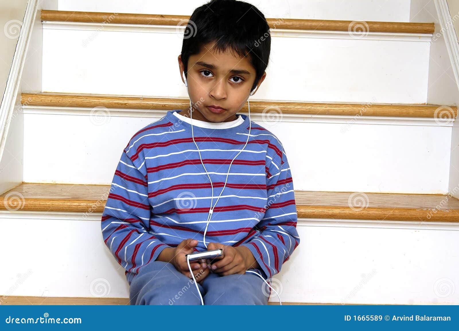Kid listening to music stock image. Image of recreation - 1665589