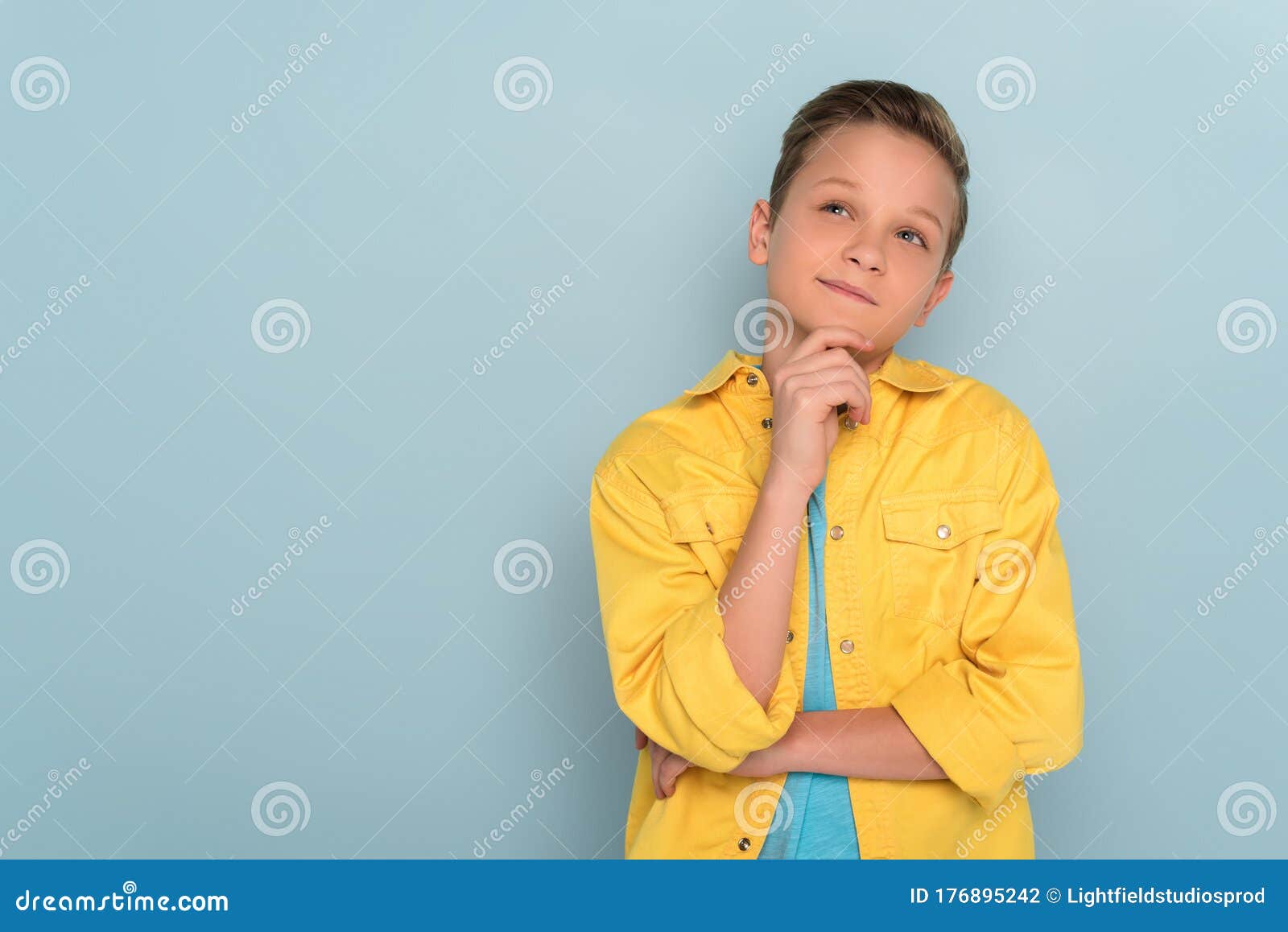 Kid Looking Up on Blue Background with Copy Space Stock Photo - Image ...