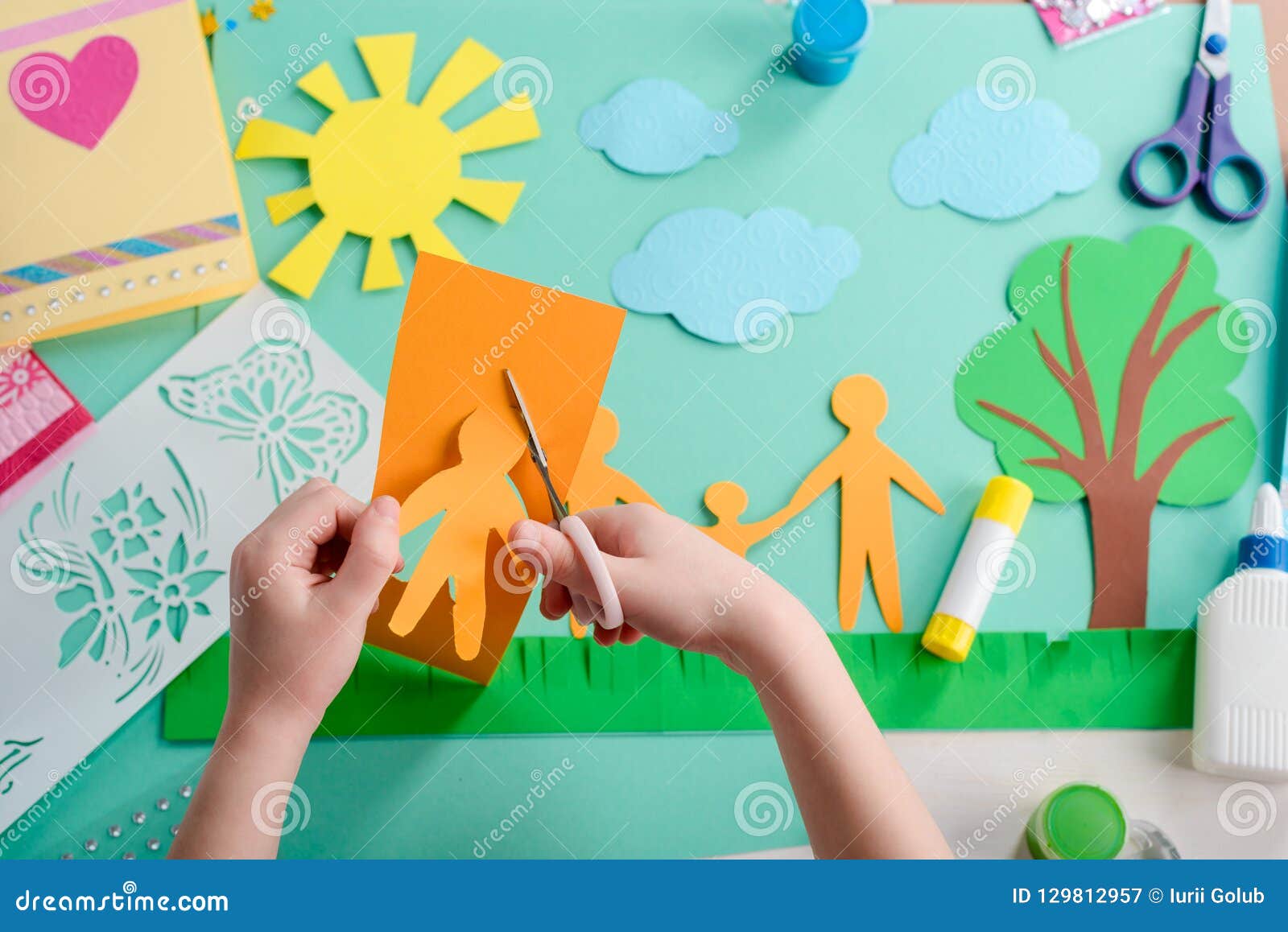 Kid is making a collage stock image. Image of handmade - 129812957