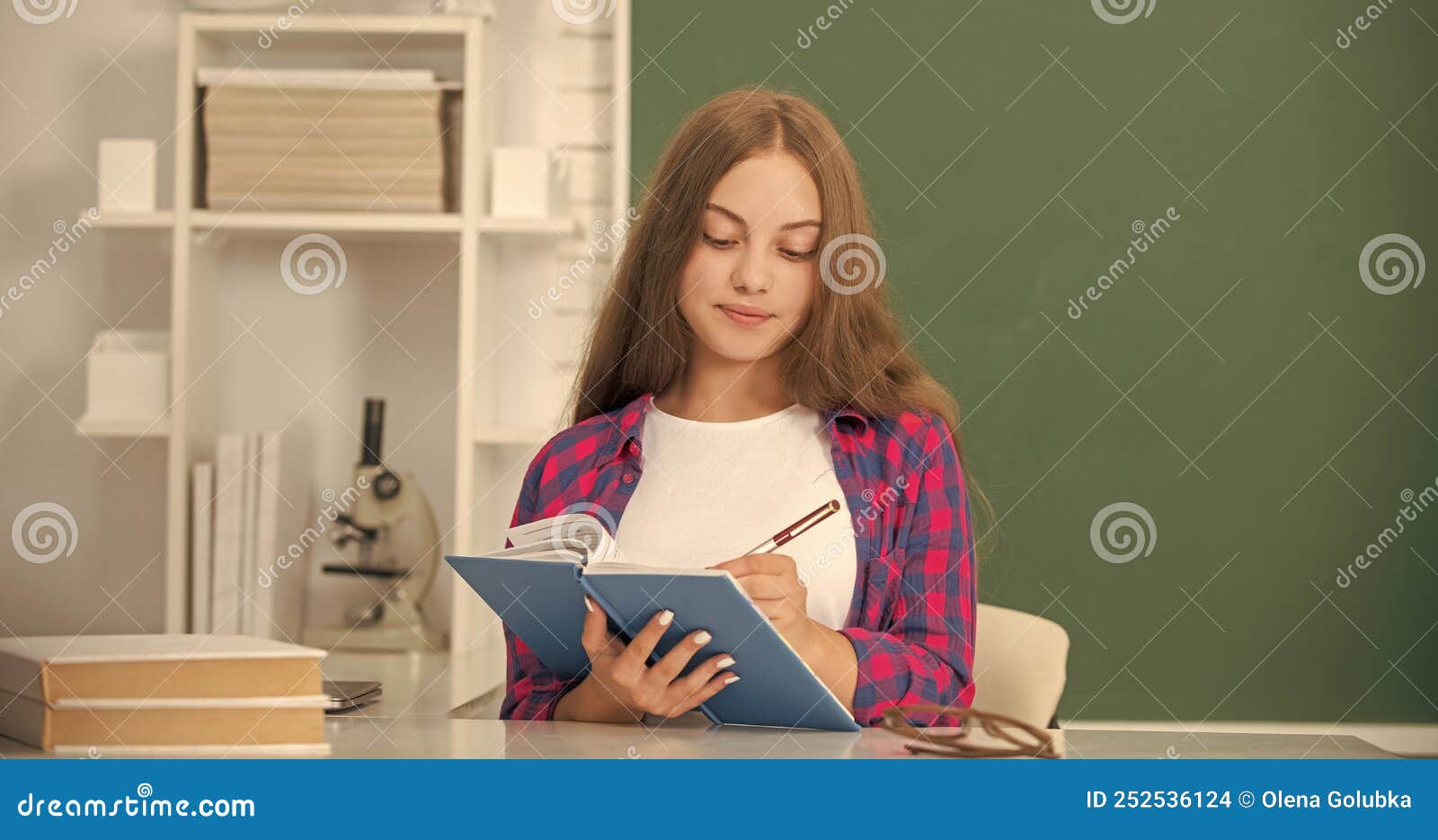 Kid Making Notes in Copybook in Classroom at Blackboard, Erudition ...