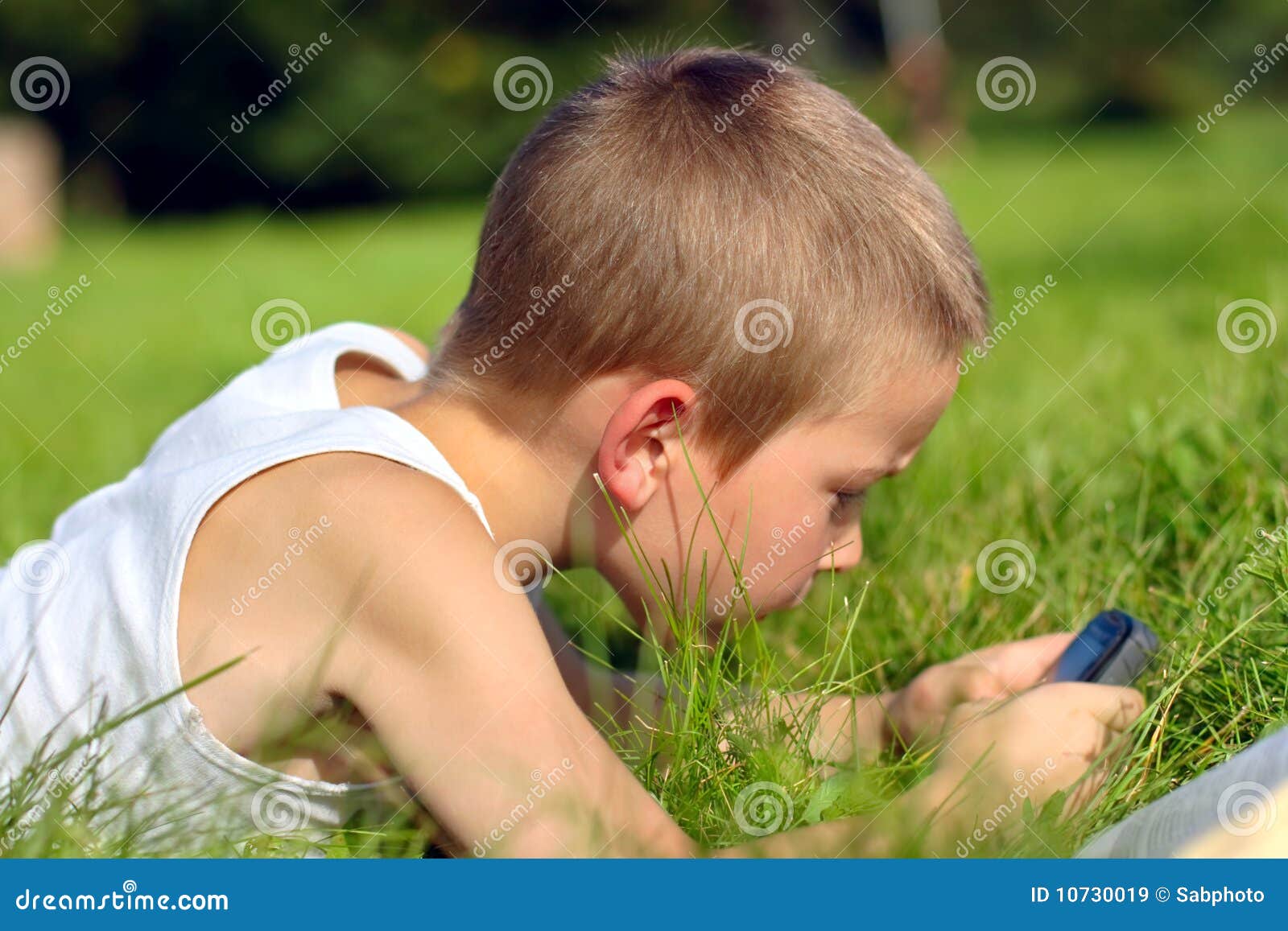 Kid with mobile phone stock image. Image of childhood - 10730019