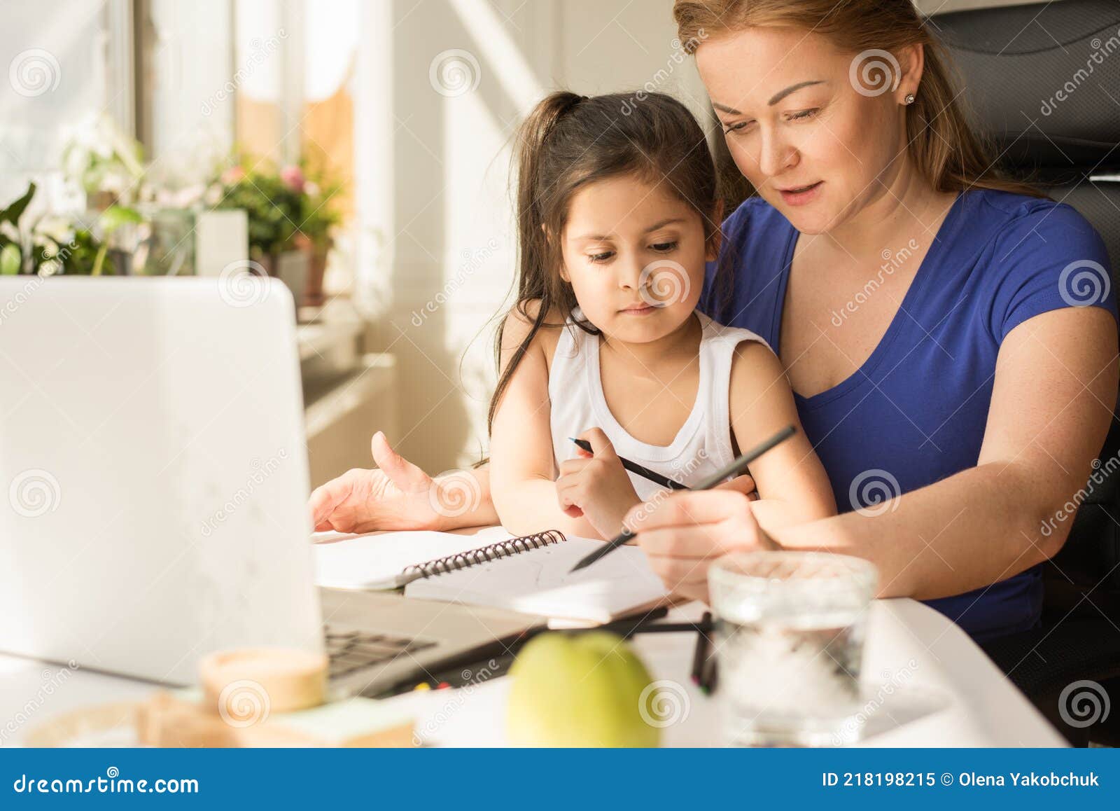 Kid and Mother Watching at Notebook while Studying and Doing Homework ...