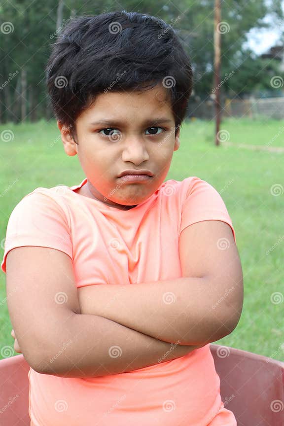 A Kid with a Not Interested Expression Stock Photo - Image of ...
