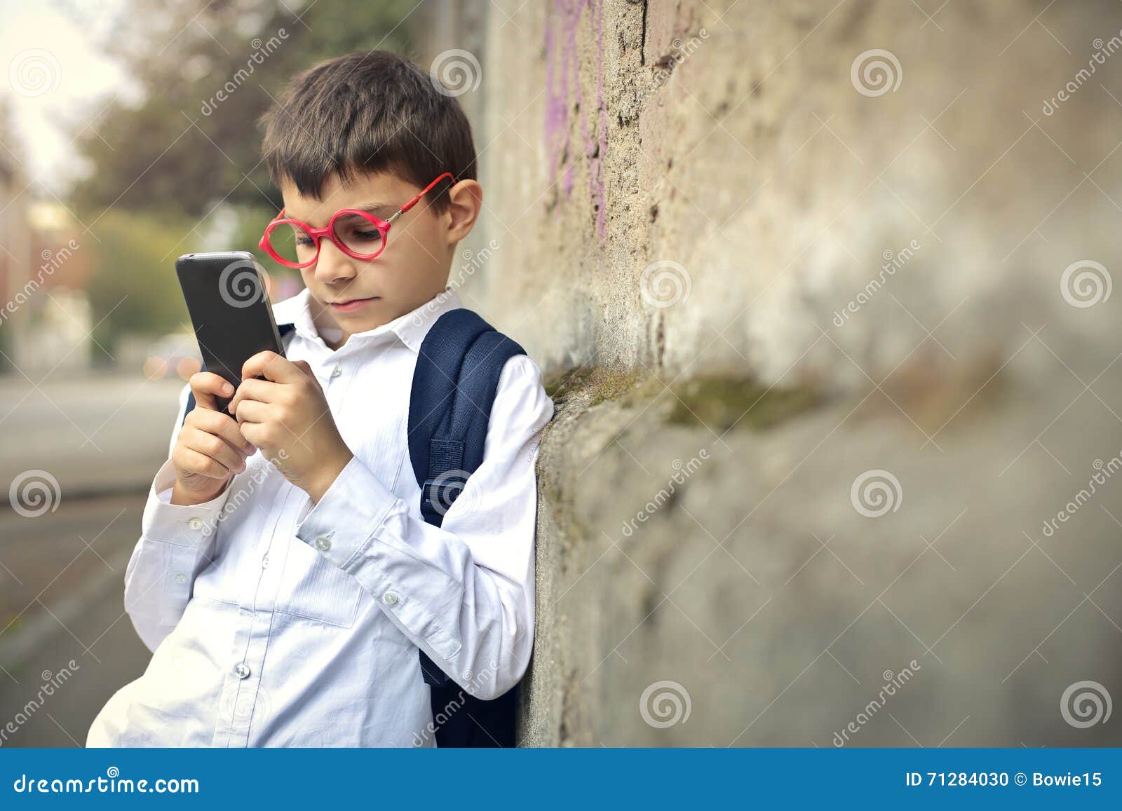 Kid with phone stock photo. Image of school, wall, phone - 71284030