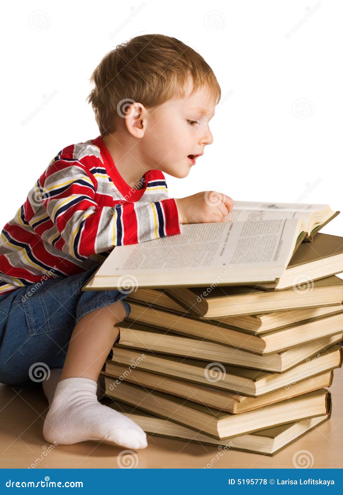 Kid with a pile of books stock photo. Image of schoolboy - 5195778