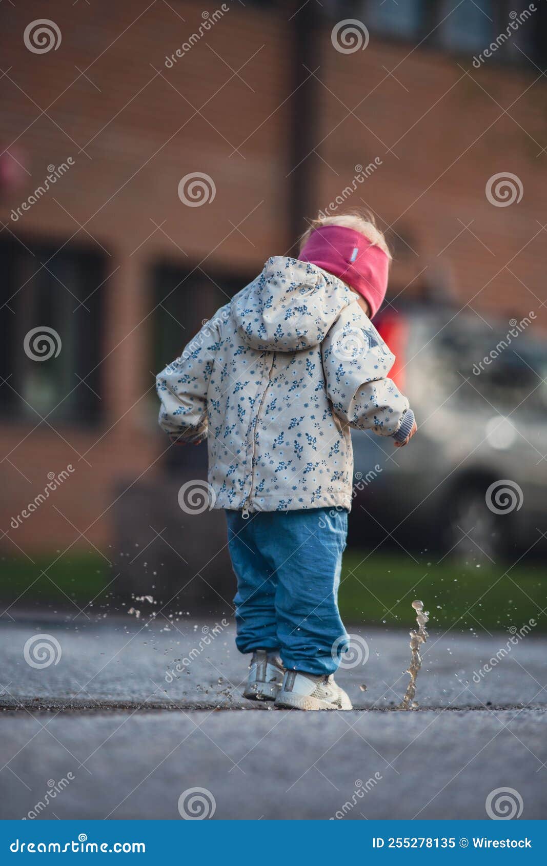 Kid Playfully Jumping into the Puddle Stock Image - Image of feet ...