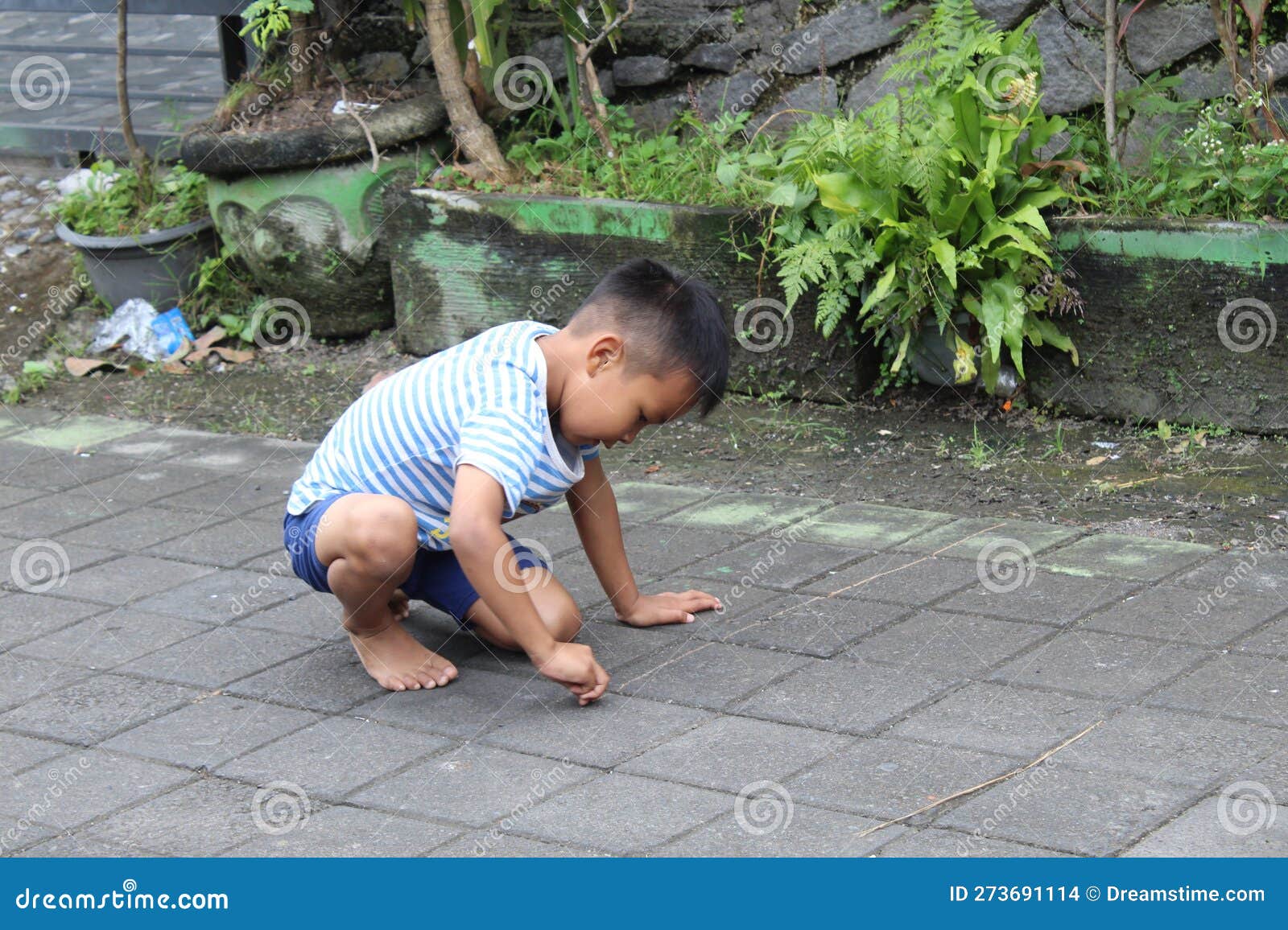 A Kid Playing Alone at the Garden Stock Photo - Image of person, male ...