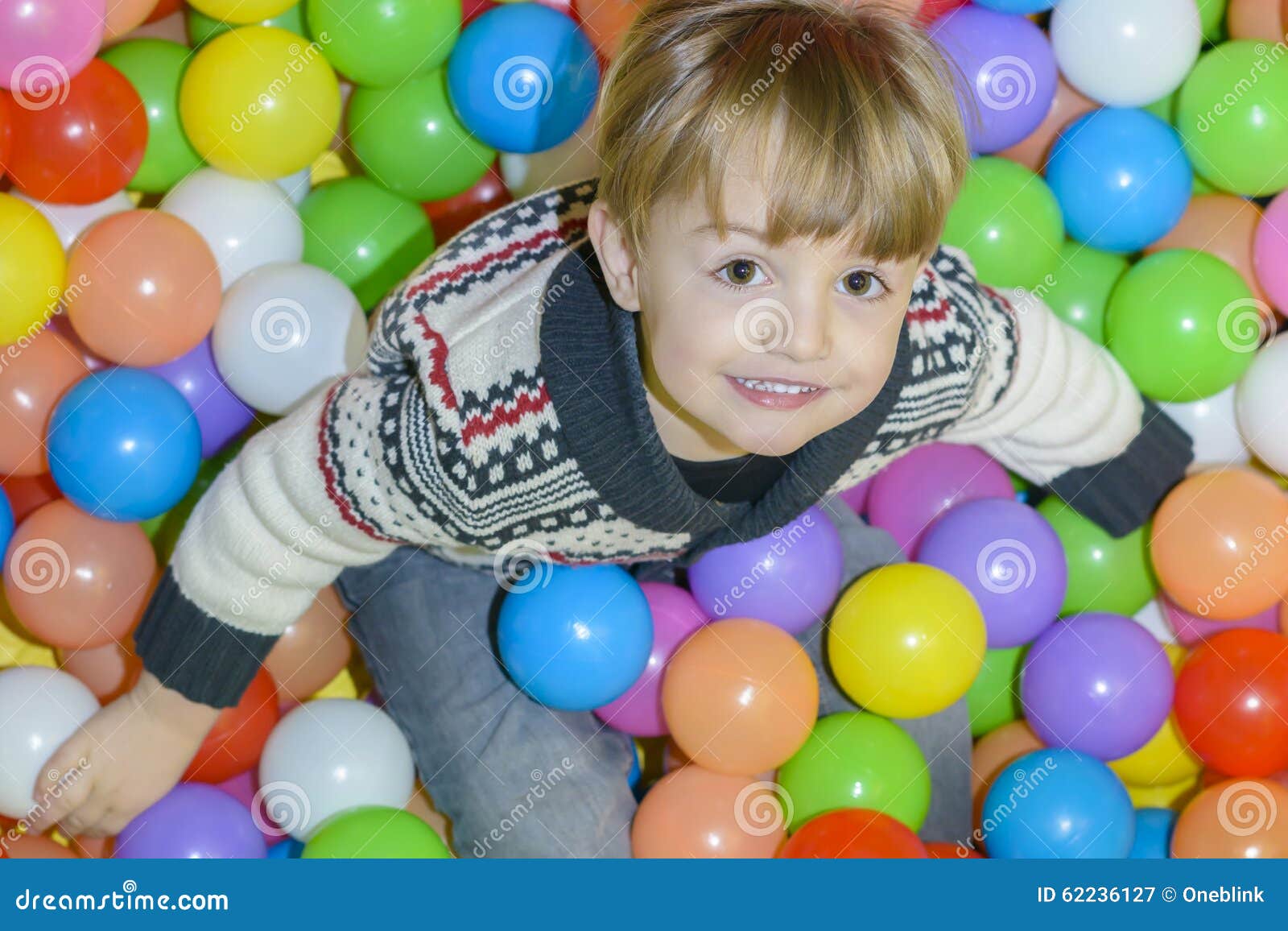 Kid Playing with Balls stock image. Image of leisure - 62236127
