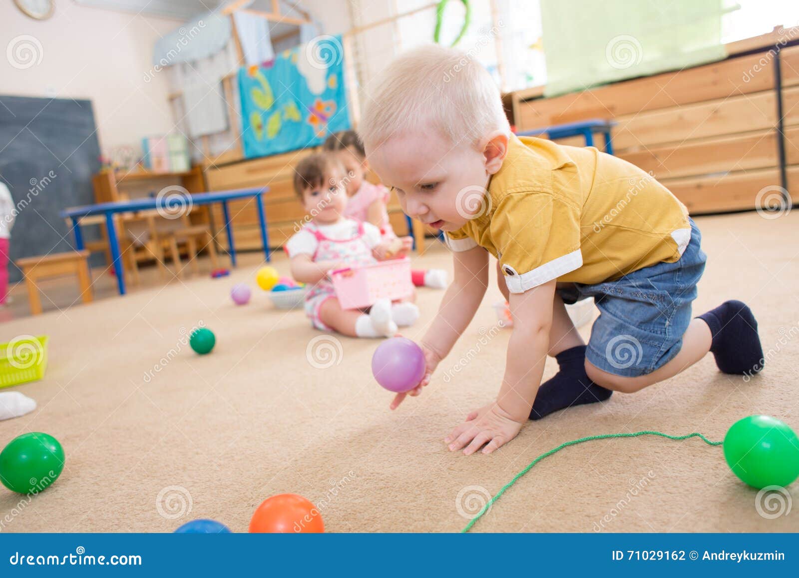 Kid Playing with Balls in Kindergarten Stock Photo - Image of playing ...