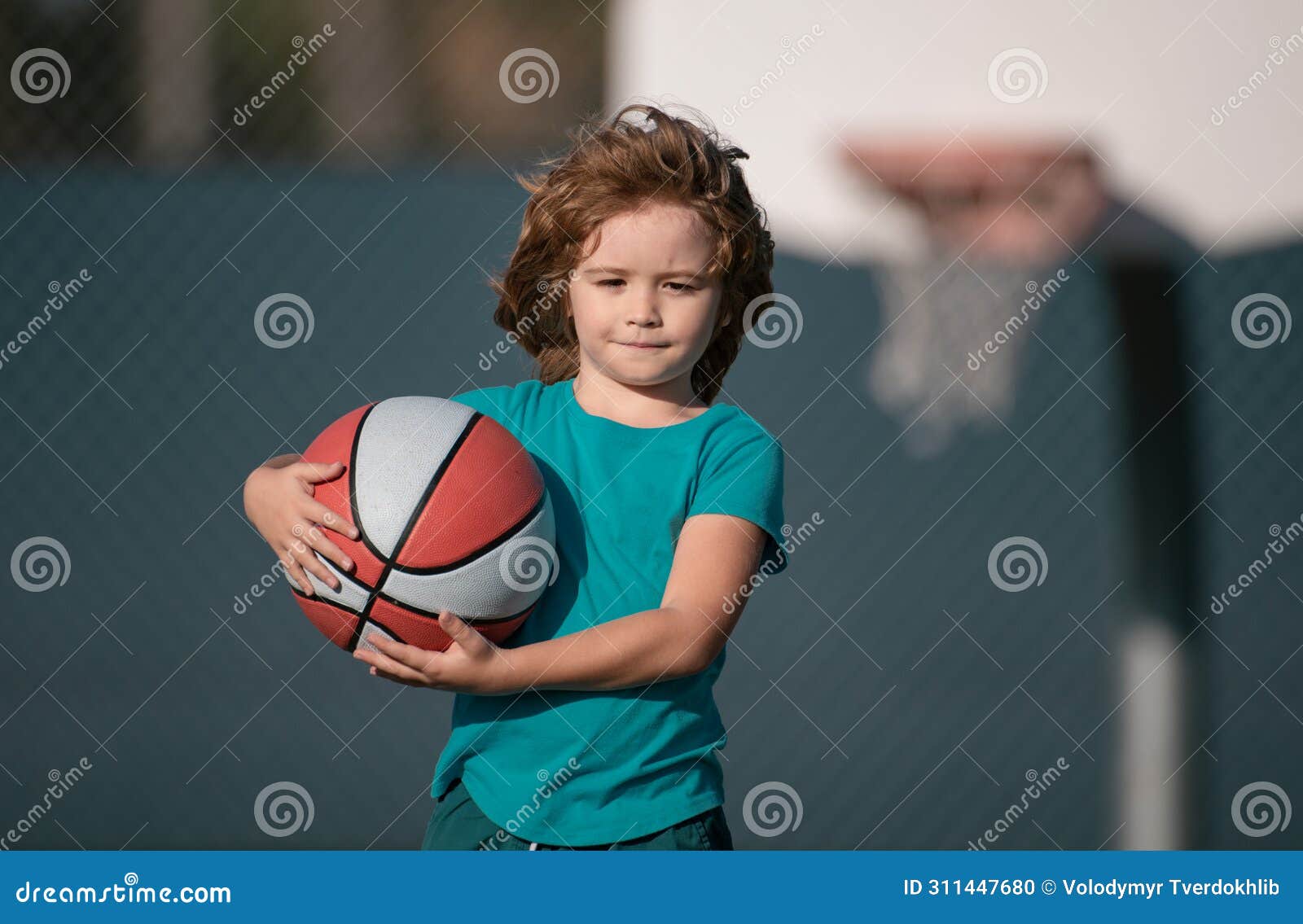 Kid Playing Basketball with Basket Ball. Kid Posing with a Basketball ...