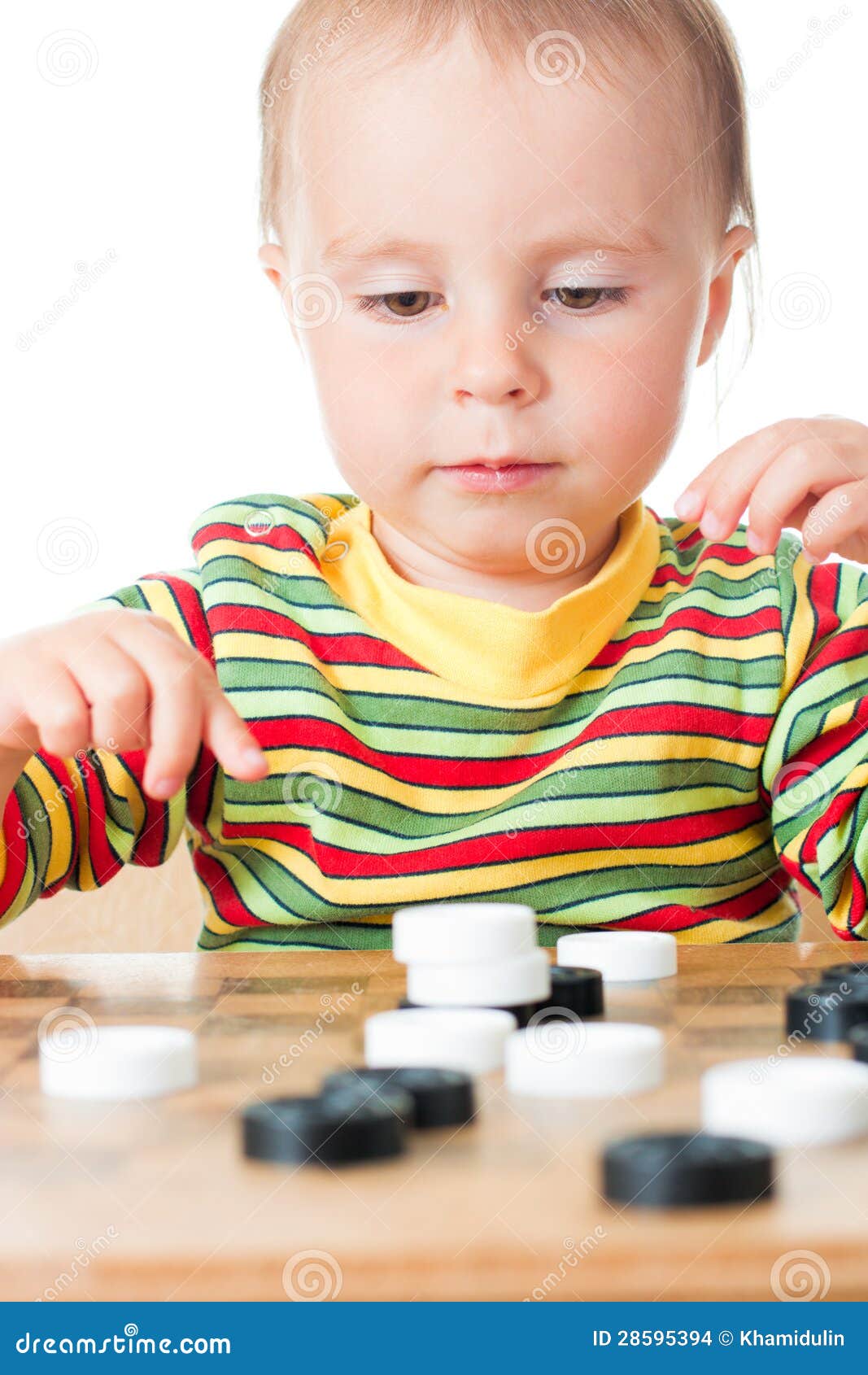 Kid playing checkers. stock photo. Image of challenge - 28595394