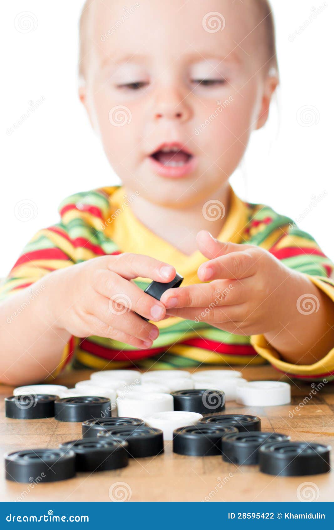 Kid playing checkers. stock photo. Image of leisure, desk - 28595422