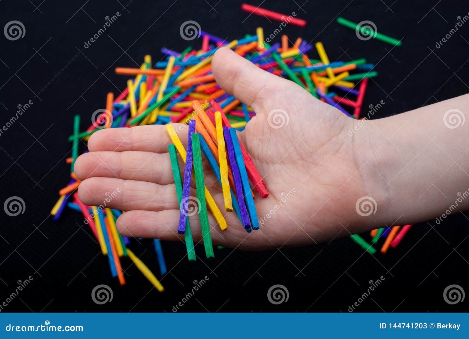 Kid Playing with Coloured Wooden Sticks for Creativity Stock Image ...