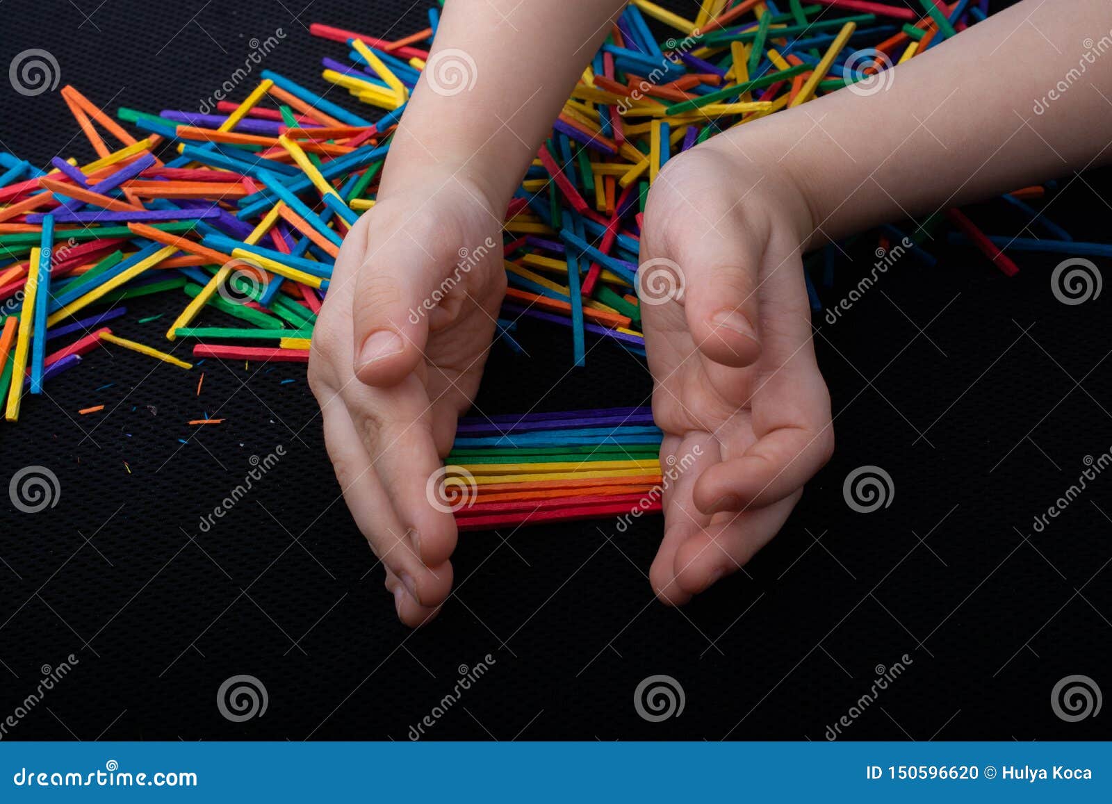 Kid Playing with Coloured Wooden Sticks for Creativity Stock Photo ...