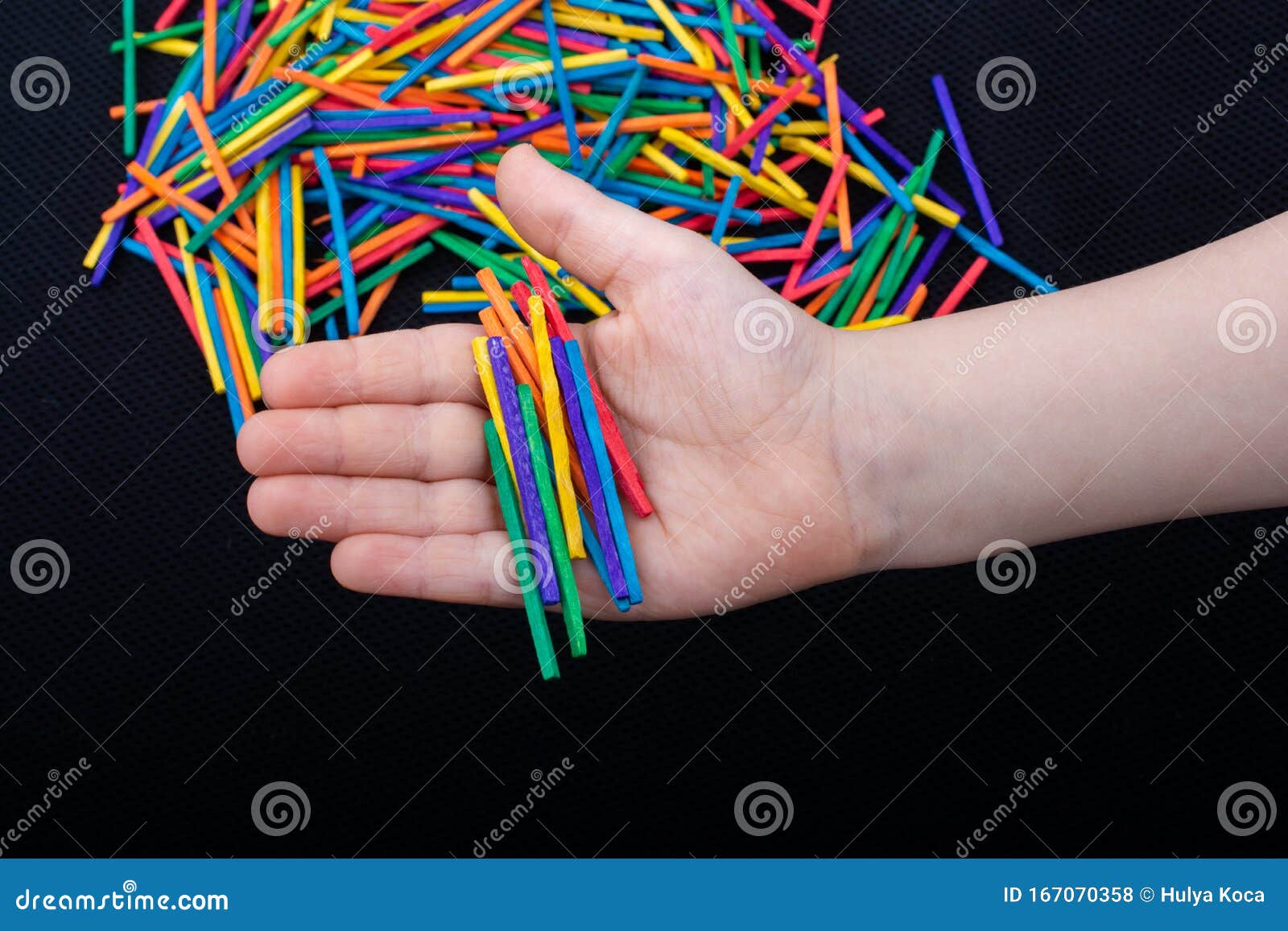 Kid Playing with Coloured Wooden Sticks for Creativity Stock Photo ...