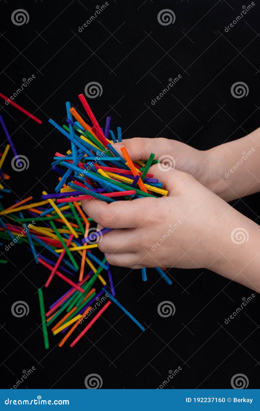 Kid Playing with Coloured Wooden Sticks for Creativity Stock Photo ...