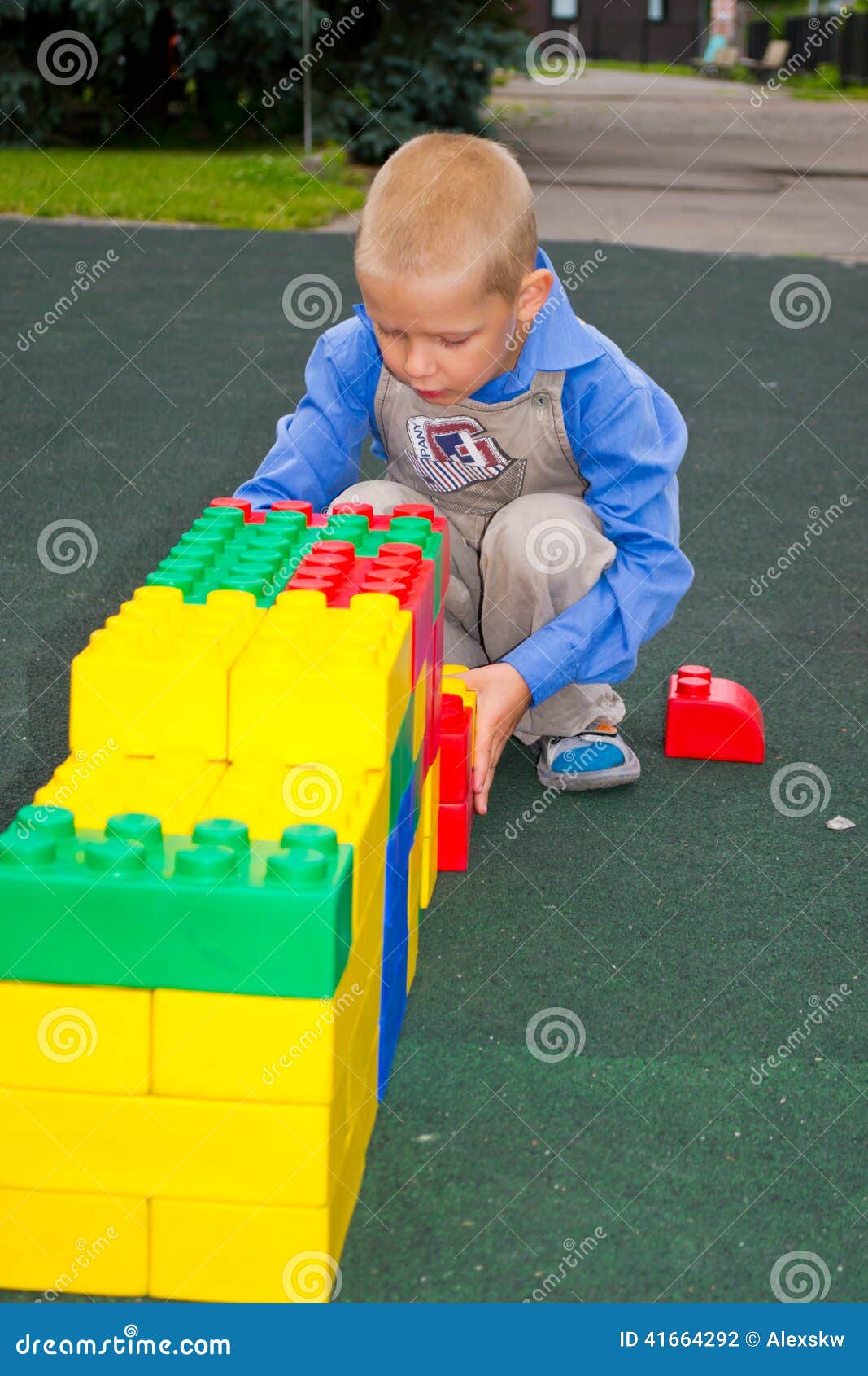 Kid playing with cubes stock photo. Image of builder - 41664292