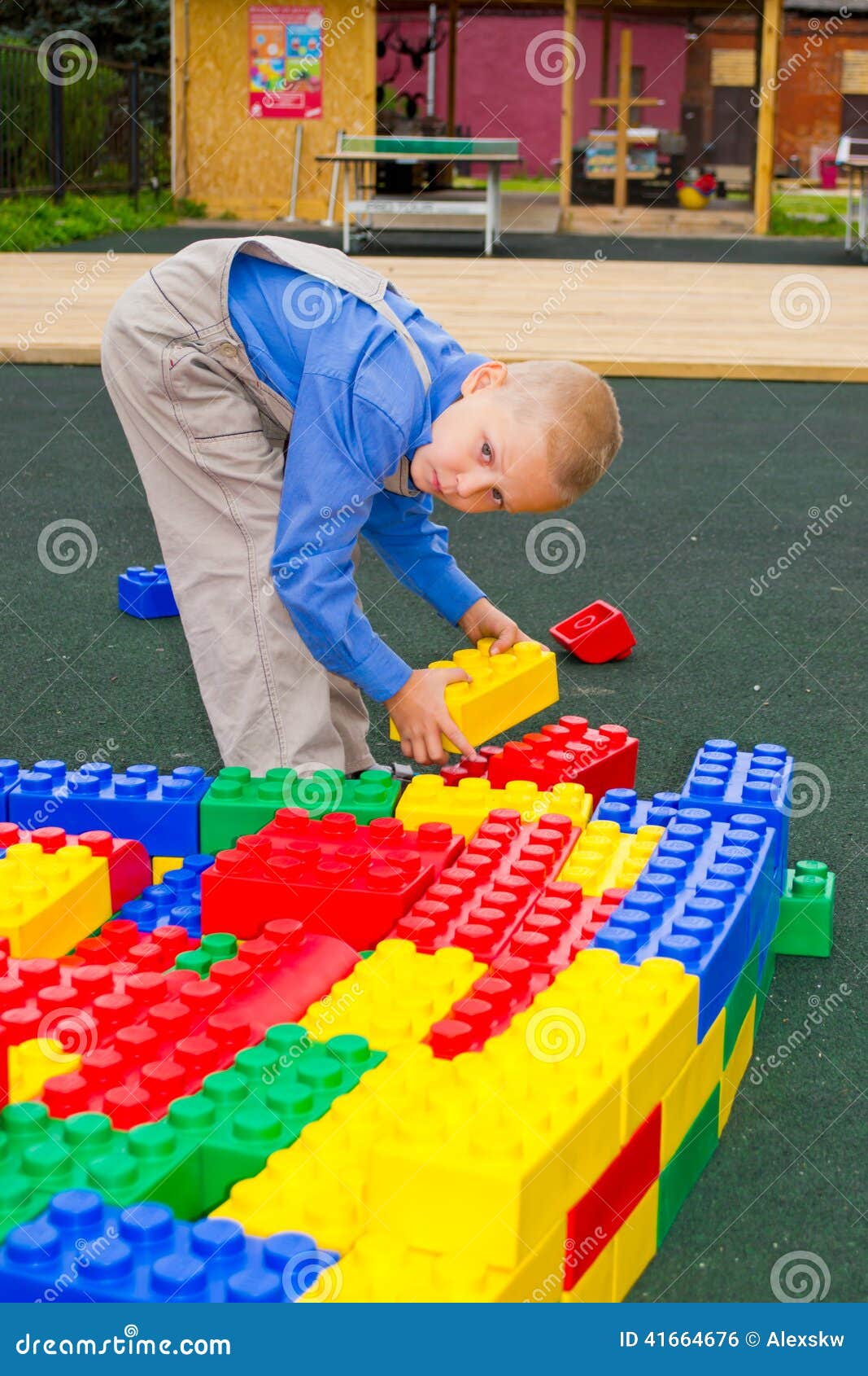 Kid playing with cubes stock photo. Image of builder - 41664676