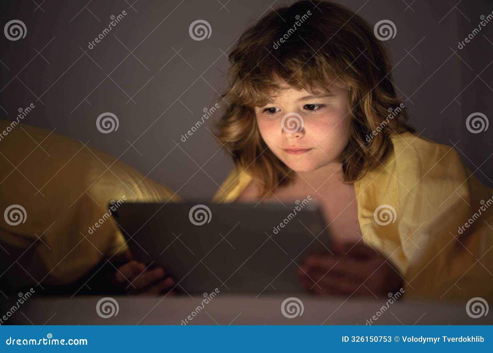 Kid Playing on a Digital Tablet. Kid Using Tablet for Gaming and Online ...