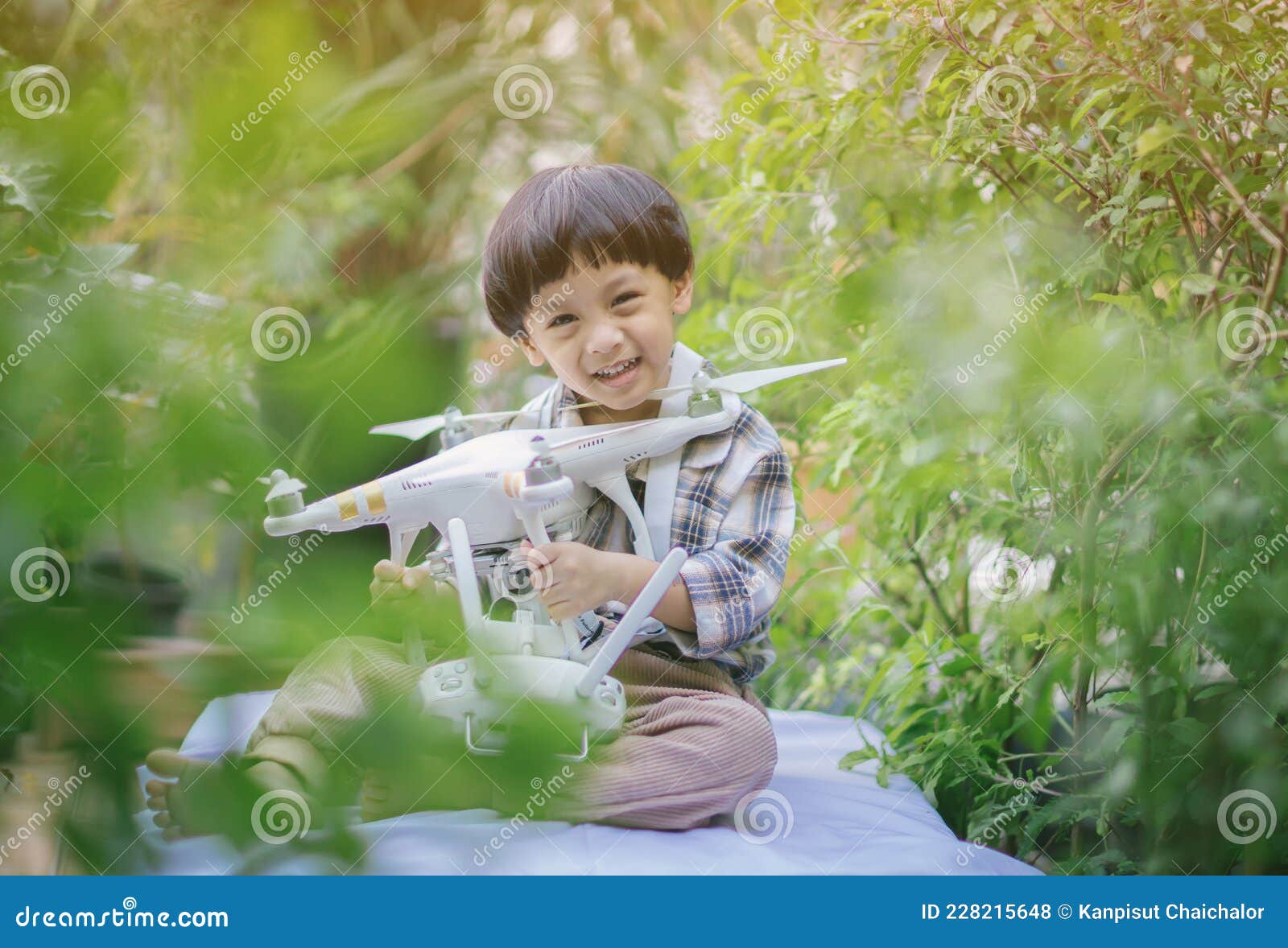 Kid Playing Drone. Little Pilot Using Drone Remote Controller. Young ...