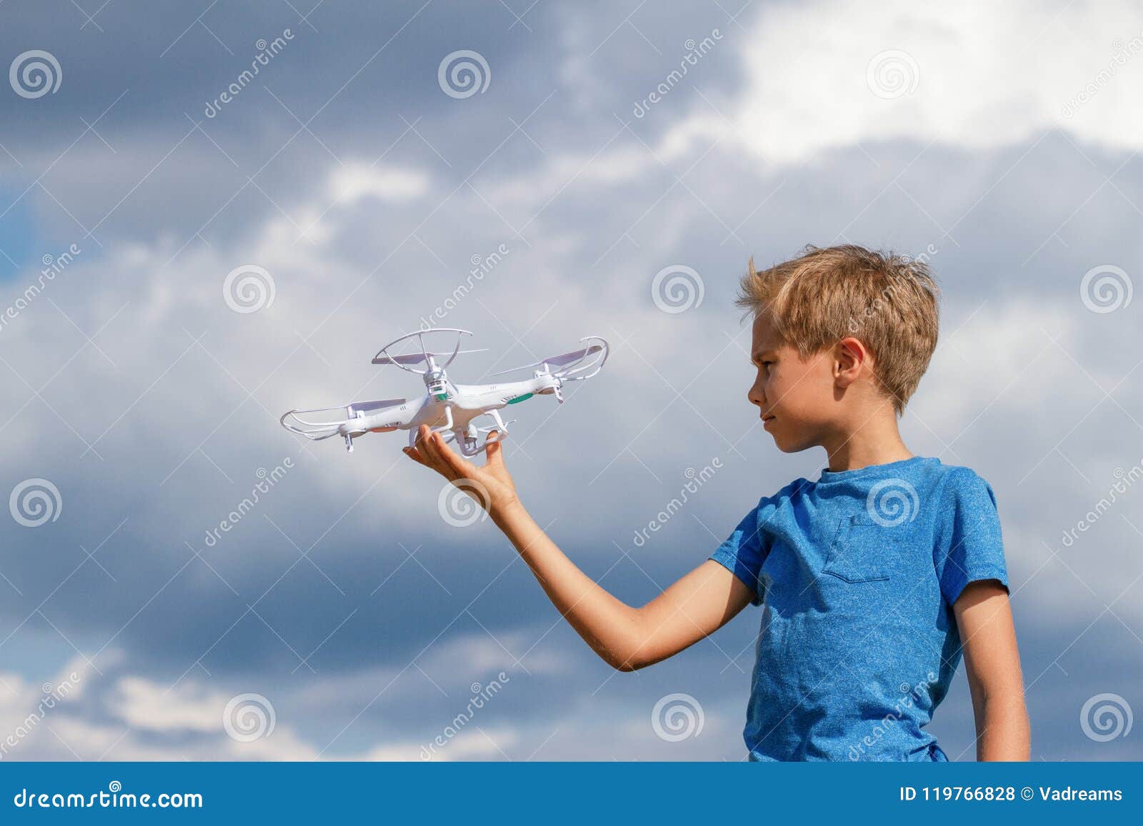 Kid Playing with Drone Outdoors Against Blue Sky Stock Photo - Image of ...