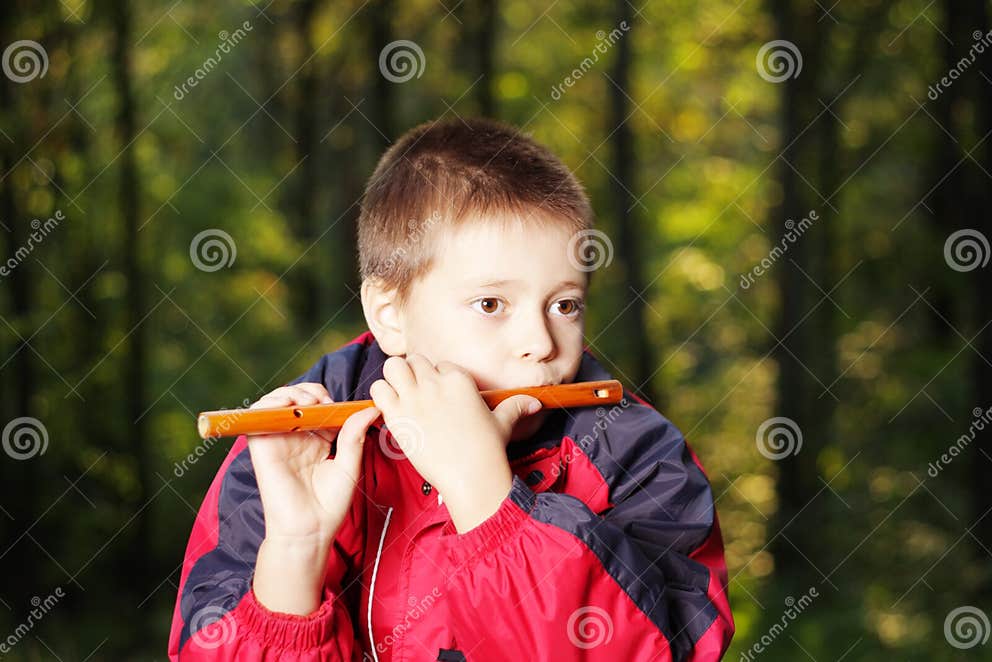 Kid Playing Flute in Dark Forest Stock Image - Image of forest, flute ...