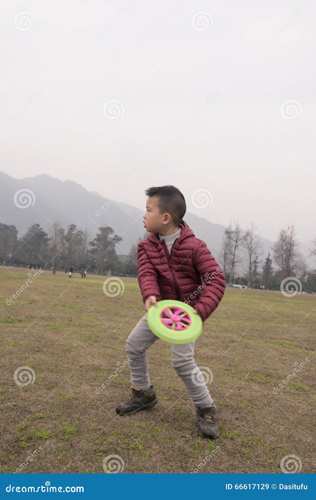 Kid playing frisbee stock image. Image of childhood, chinese - 66617129