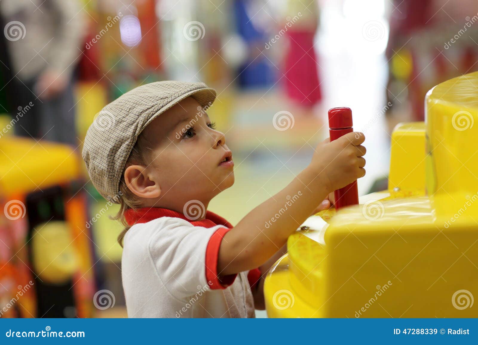 Kid Playing with Game Machine Stock Image - Image of game, child: 47288339