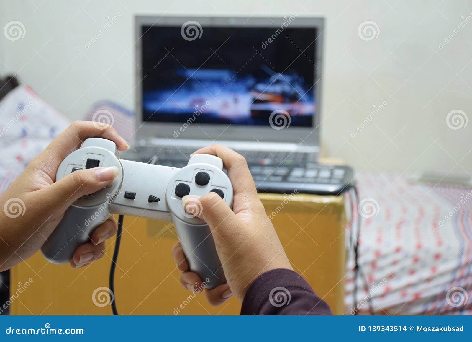 Kid Playing games at home stock photo. Image of living - 139343514