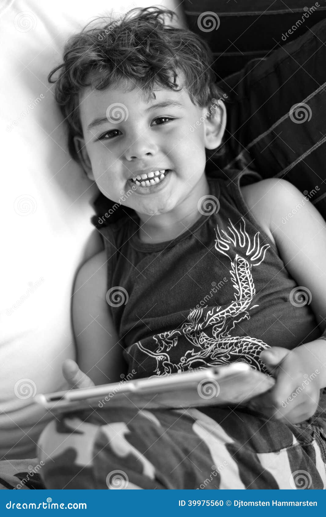 Kid playing with i-pad stock photo. Image of playing - 39975560