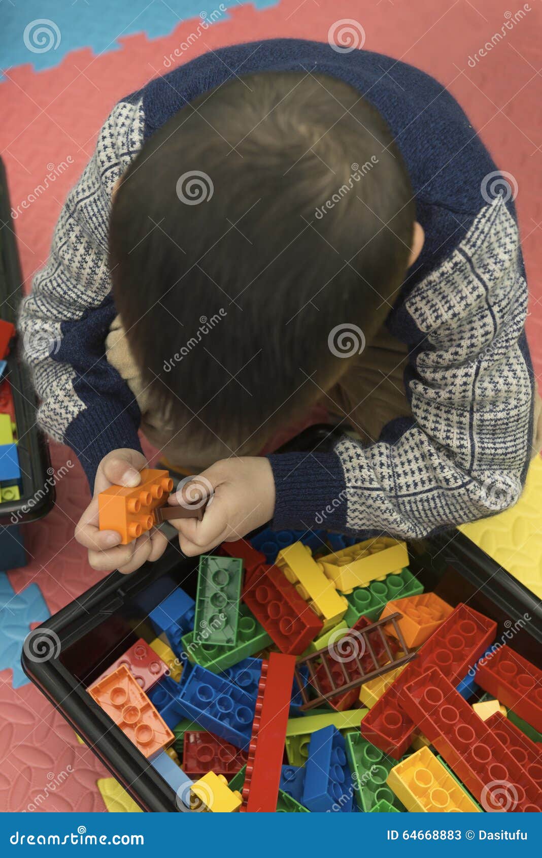 Kid playing lego stock image. Image of childhood, dedicated - 64668883