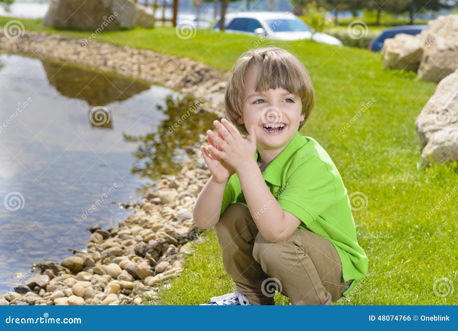 Kid Playing with Pebbles stock photo. Image of playing - 48074766